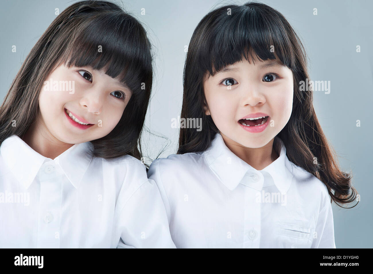 two female kids smiling together Stock Photo - Alamy