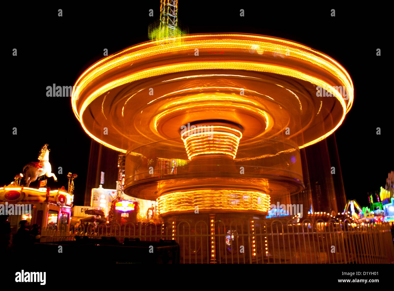 long exposure pictures of amusement park rides and wheels at night ...