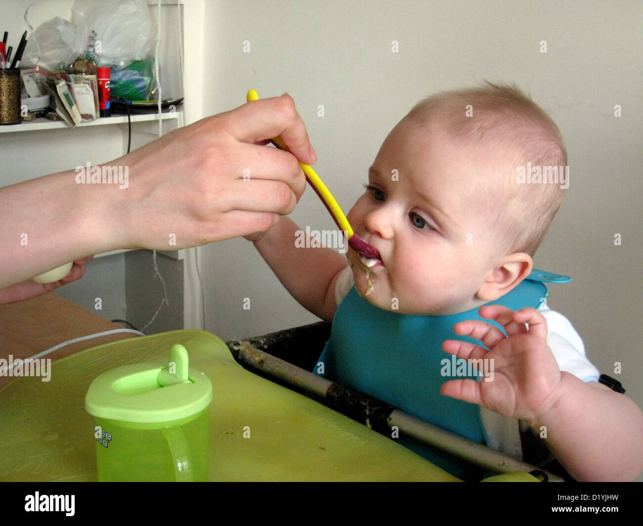 six month old baby being spoon fed Stock Photo - Alamy