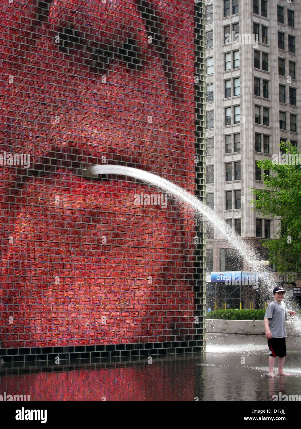 art insulation on an outdoor wall with a portrait of a face with water ...