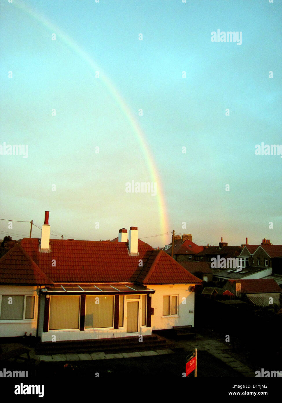 Rainbow over suburbia Stock Photo - Alamy