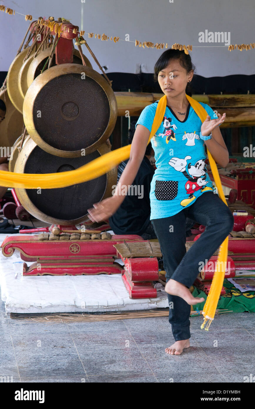 A dance student practices moves for a Javanese court dance at the ...