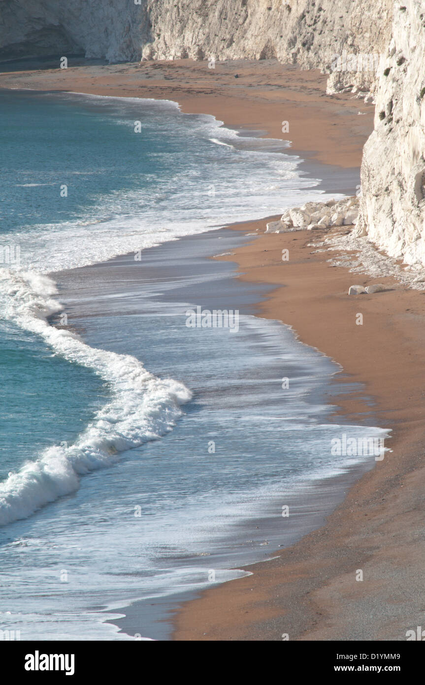 The beach and breaking surf below the Chalk cliffs at Scratchy Bottom ...