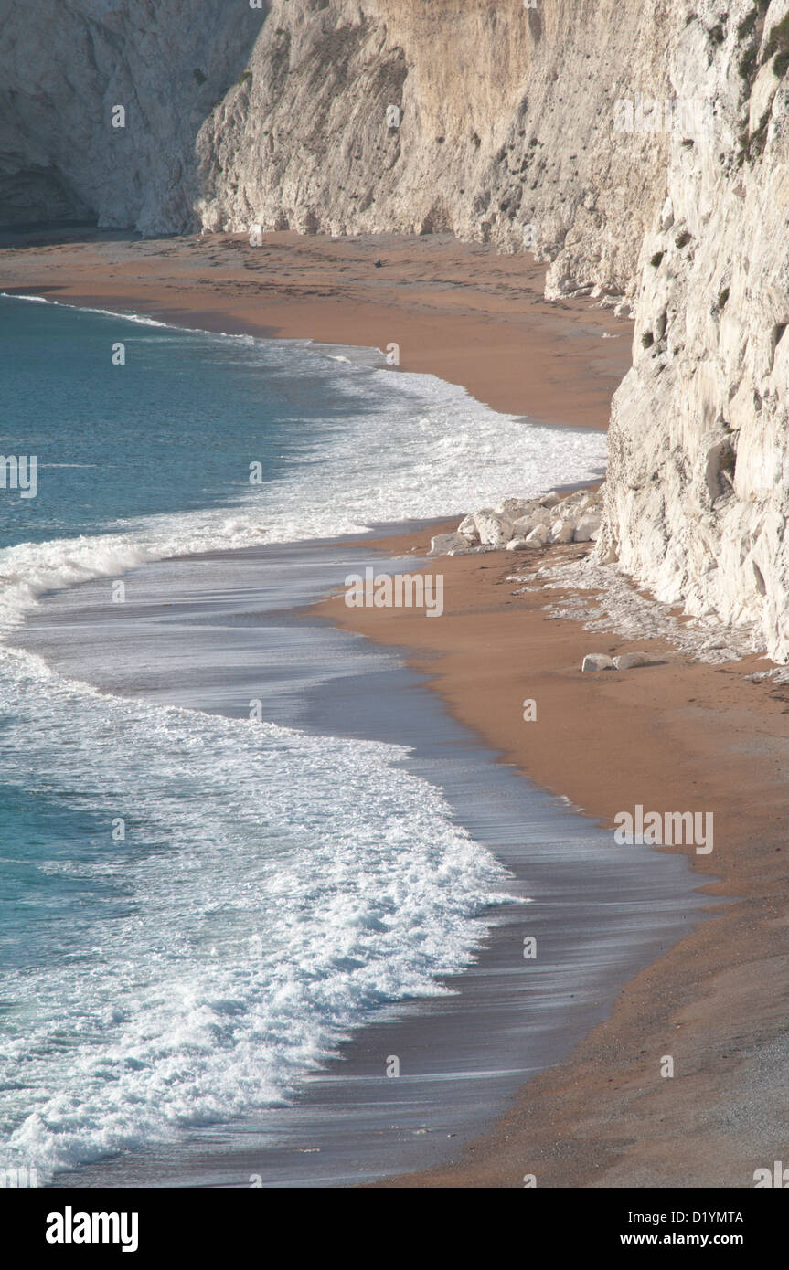 The beach and breaking surf below the Chalk cliffs at Scratchy Bottom ...