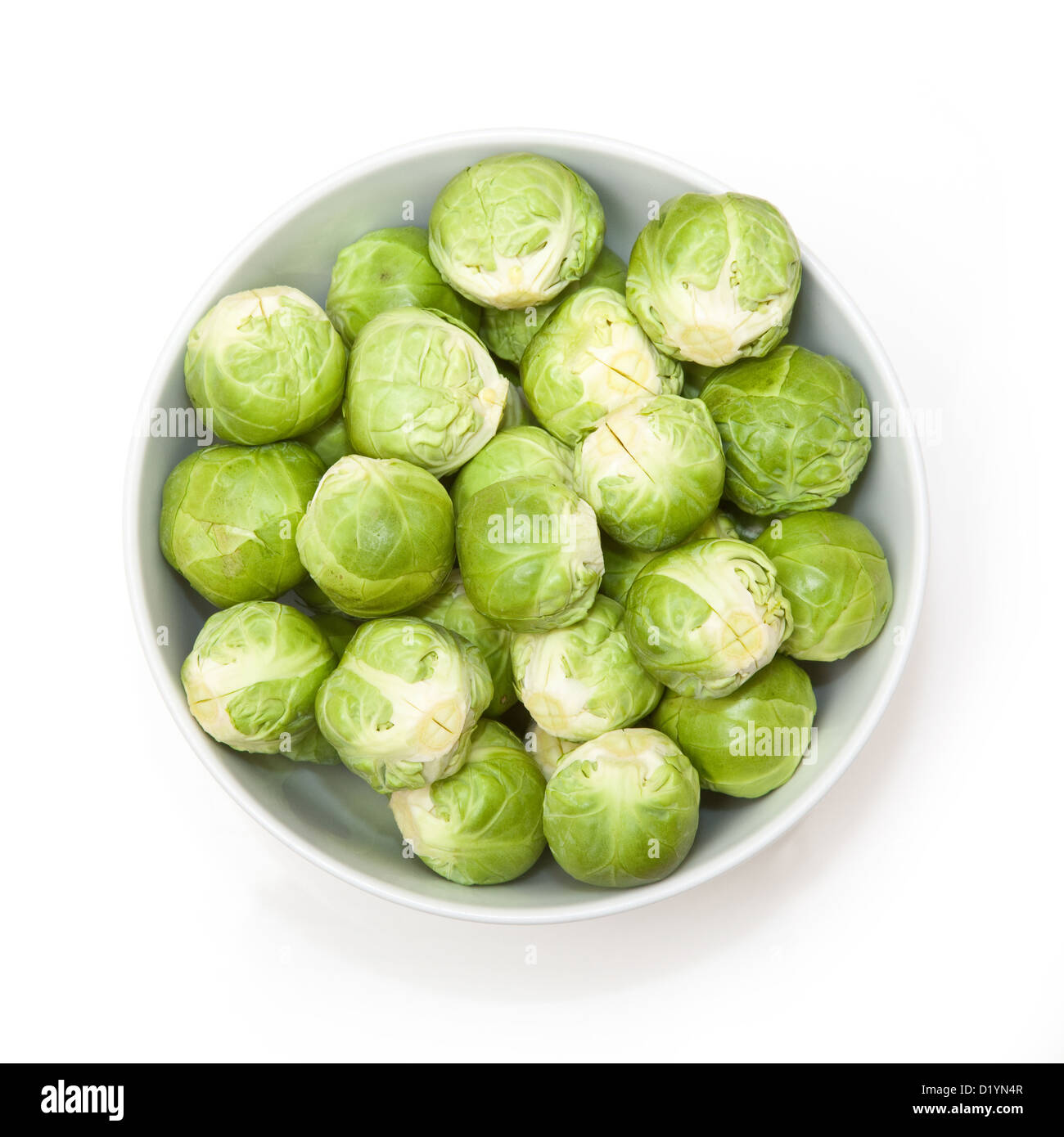 Bowl of trimmed brussel sprouts isolated on a white studio background ...