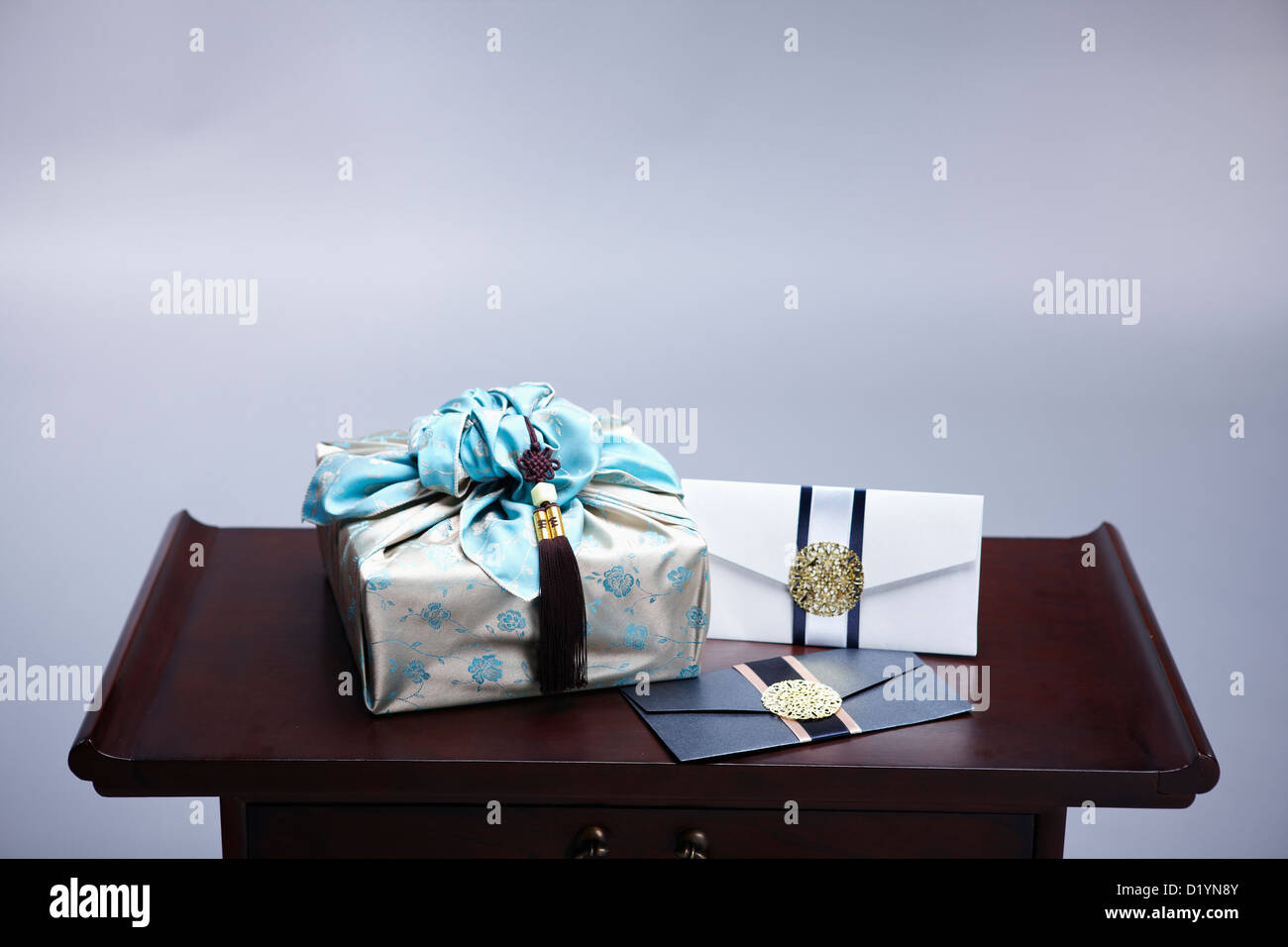 a package in Korean traditional wrap and envelopes on traditional table ...