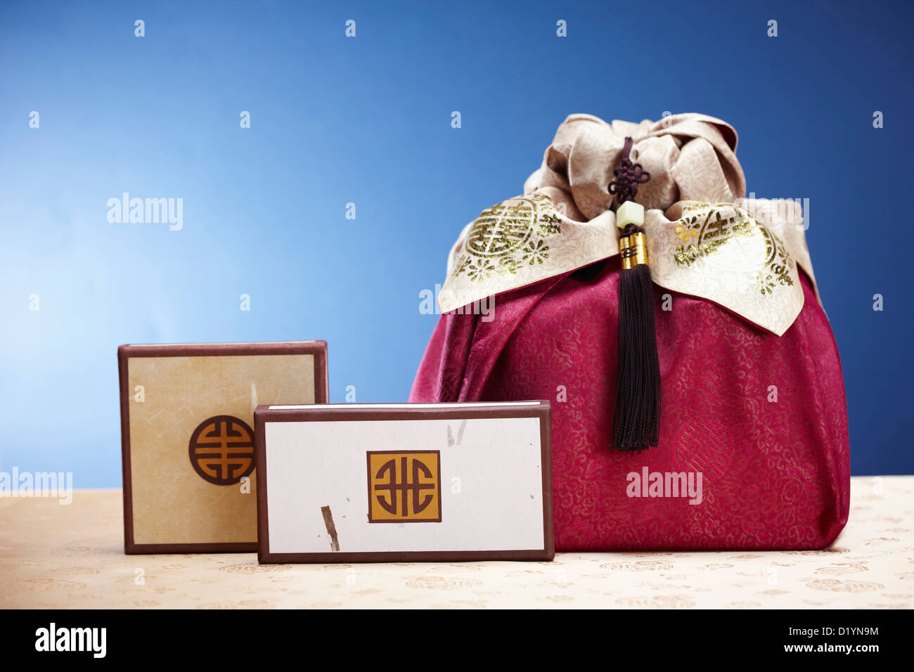 Korean traditional boxes in front of a package in a red Korean ...
