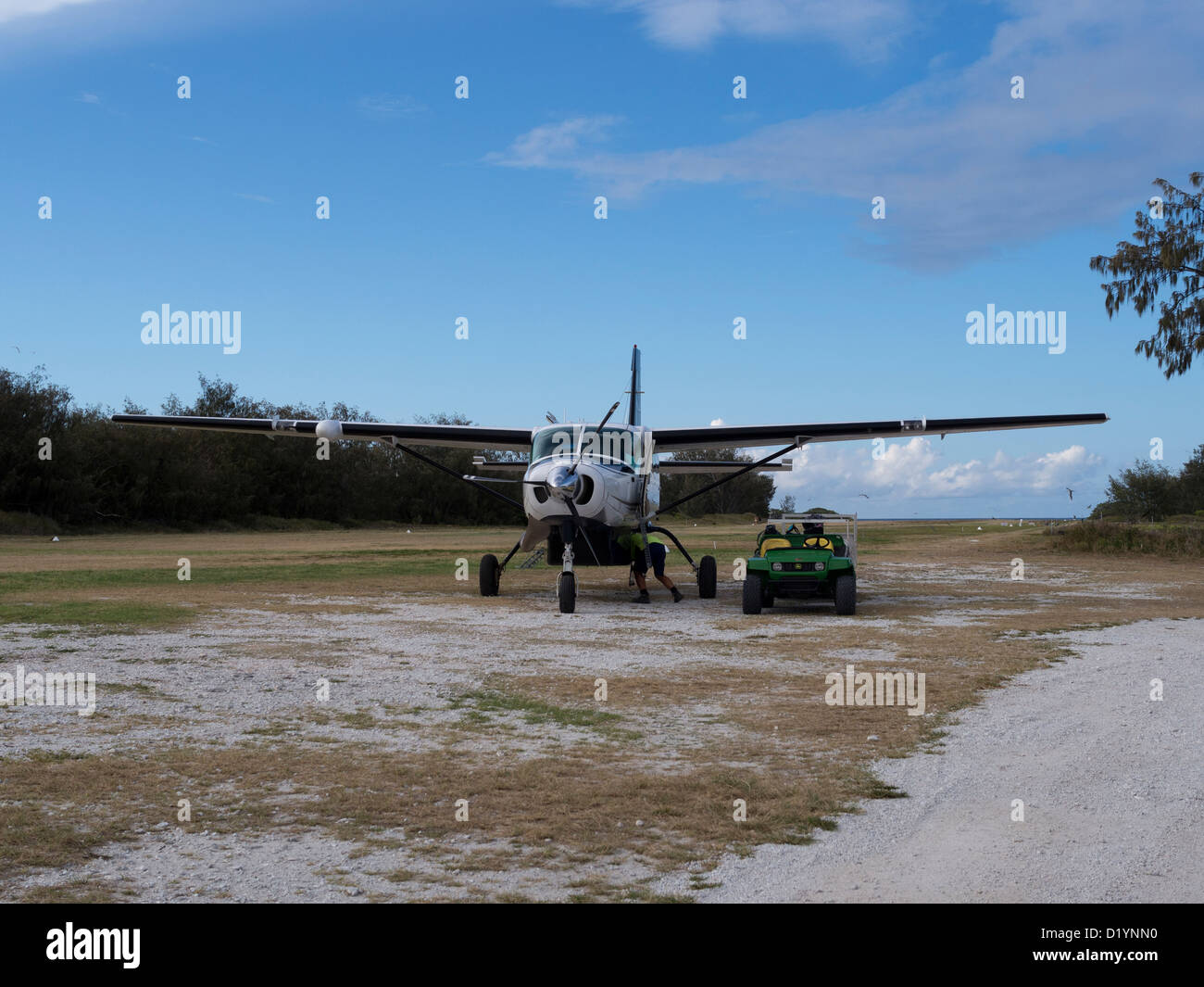 A single propeller aircraft on the runway at Lady Elliott Island ...