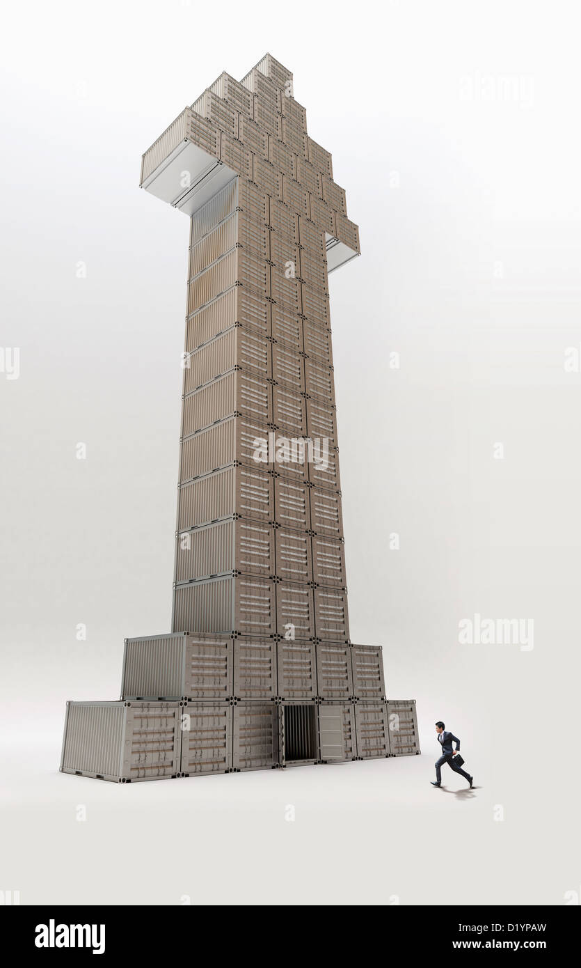 a businessman running into a arrow shaped building Stock Photo - Alamy