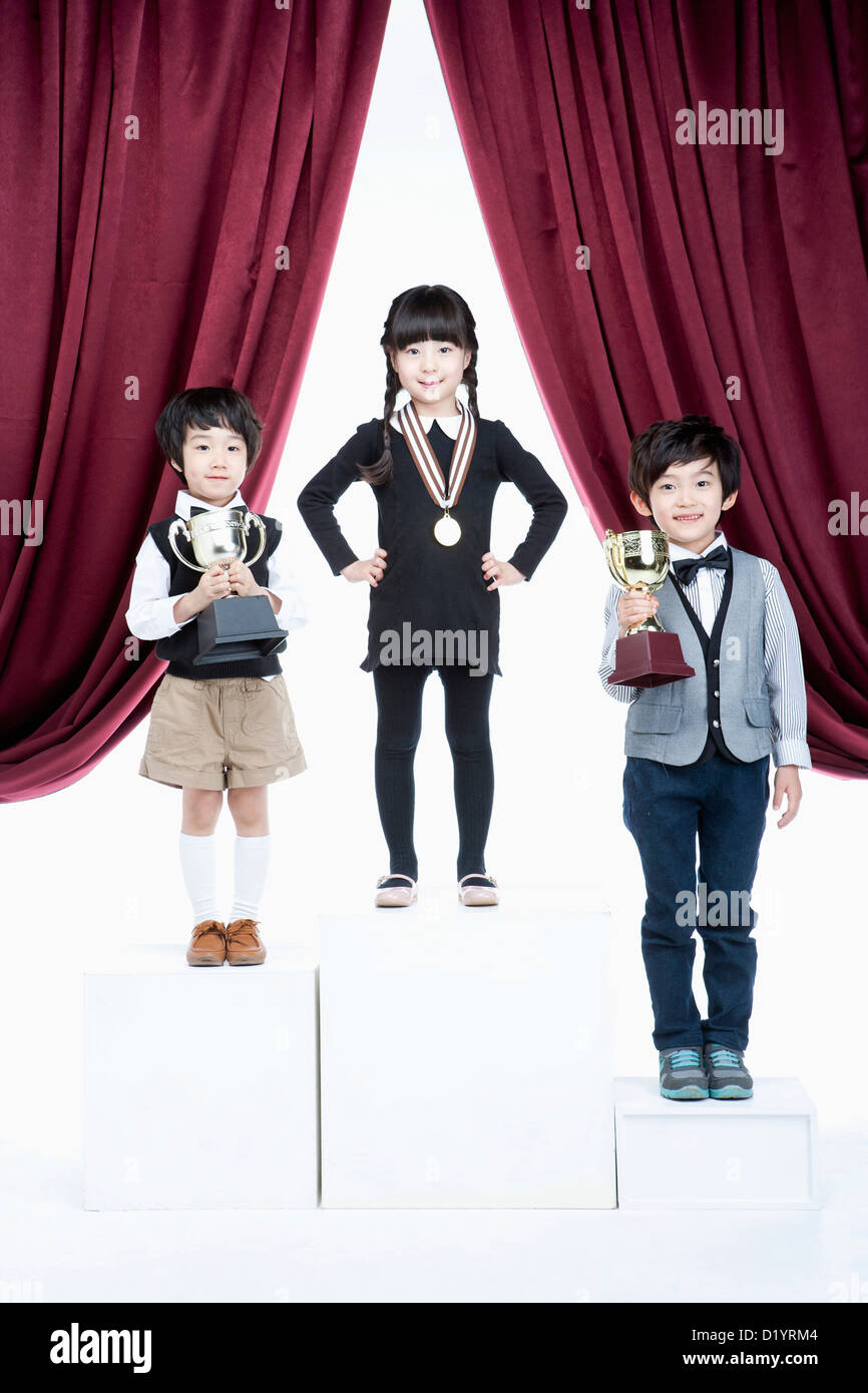 Child podium trophy hi-res stock photography and images - Alamy