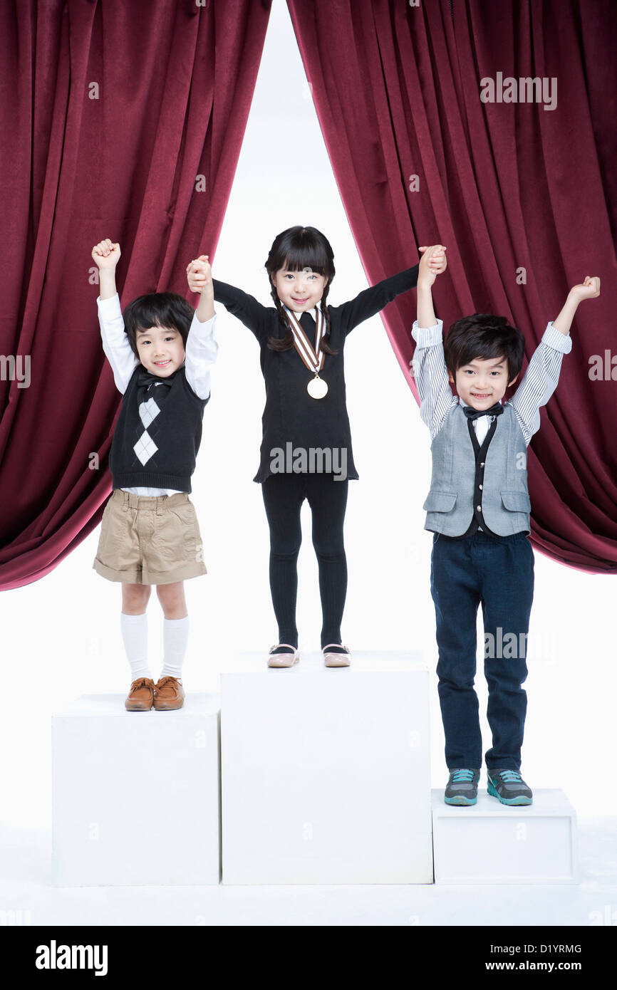 Child podium trophy hi-res stock photography and images - Alamy