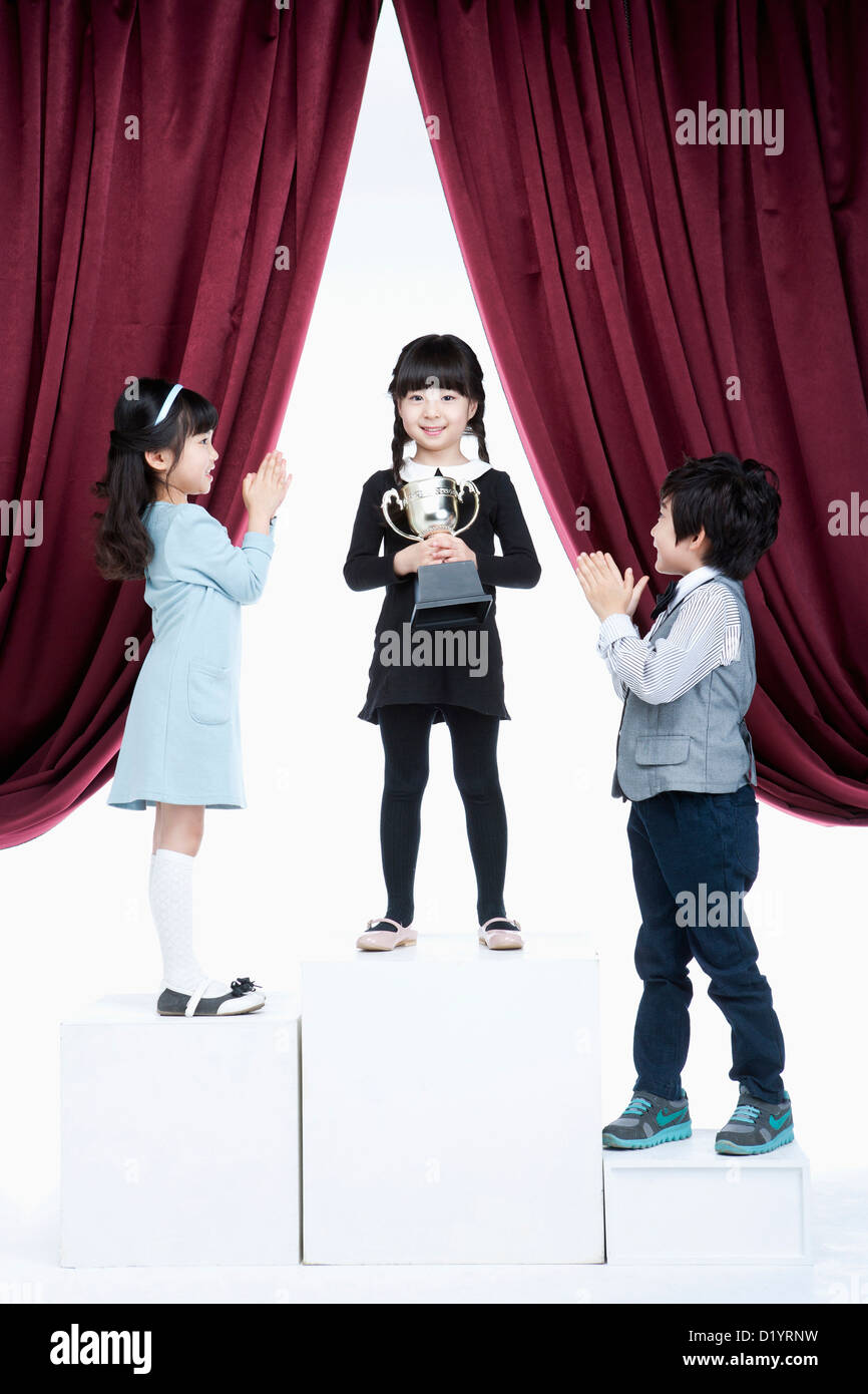 Child podium trophy hi-res stock photography and images - Alamy