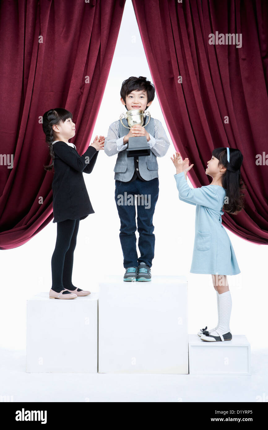 Child podium trophy hi-res stock photography and images - Alamy
