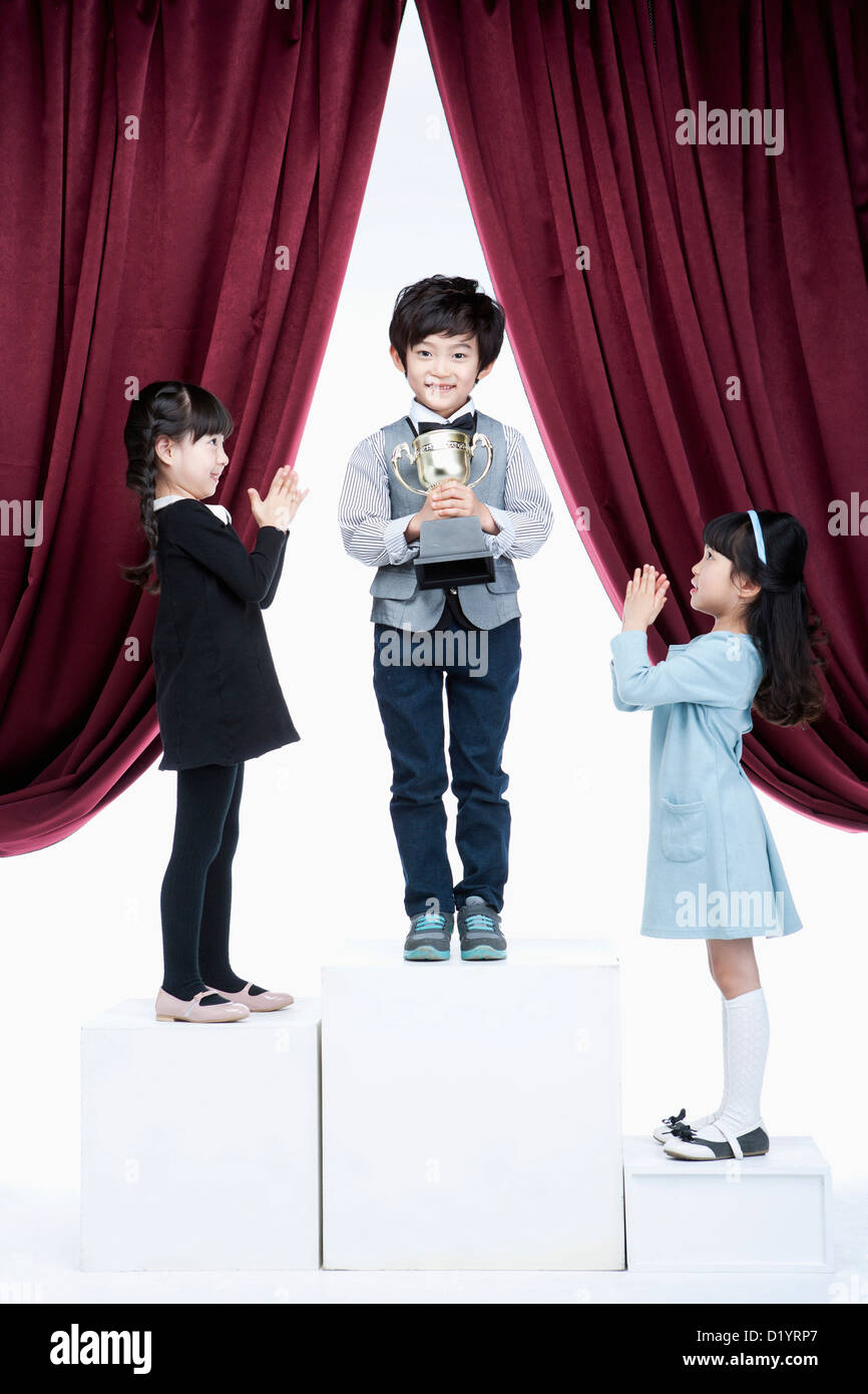 Child podium trophy hi-res stock photography and images - Alamy