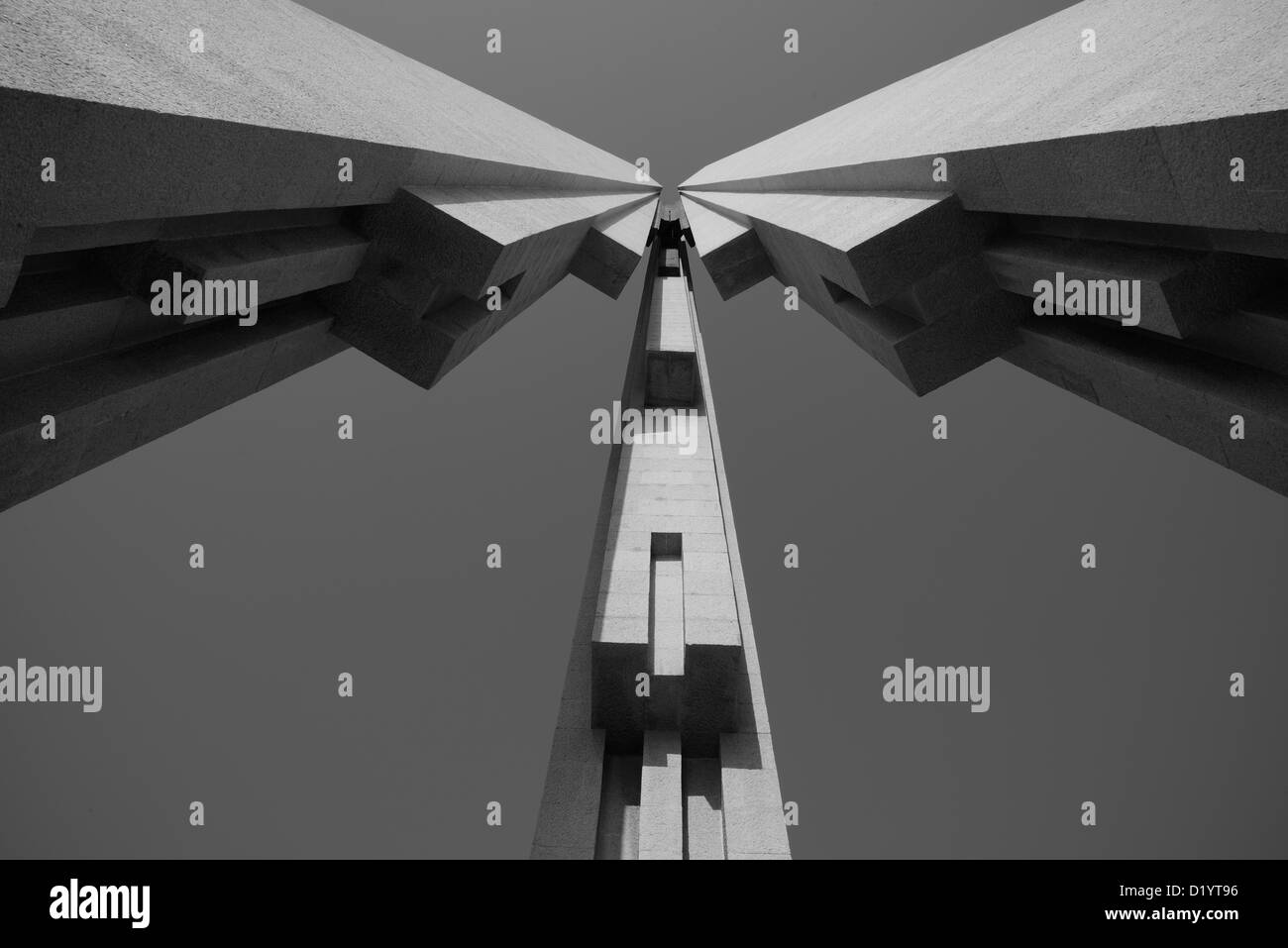 A tall and abstract memorial monument located along the riverside of ...