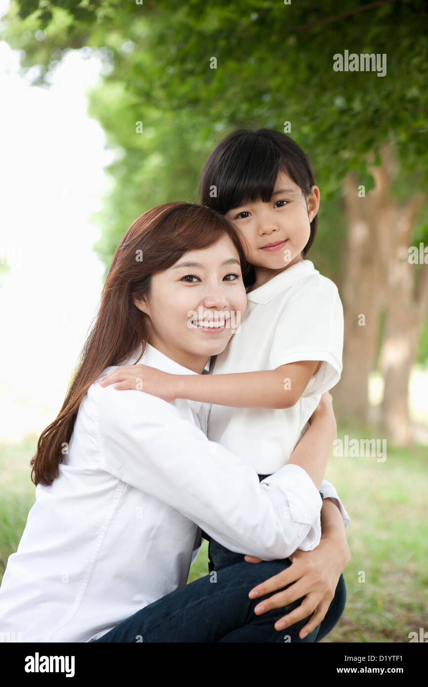 a mother hugging a daughter Stock Photo - Alamy