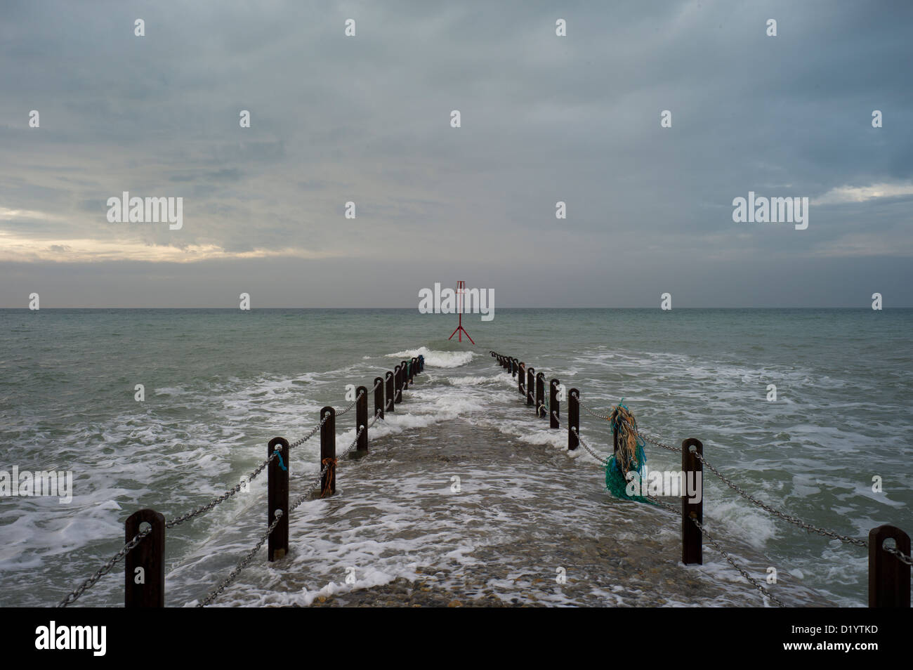 Groyne partly submerged, morning sky, Brighton and Hove, Sussex Stock ...