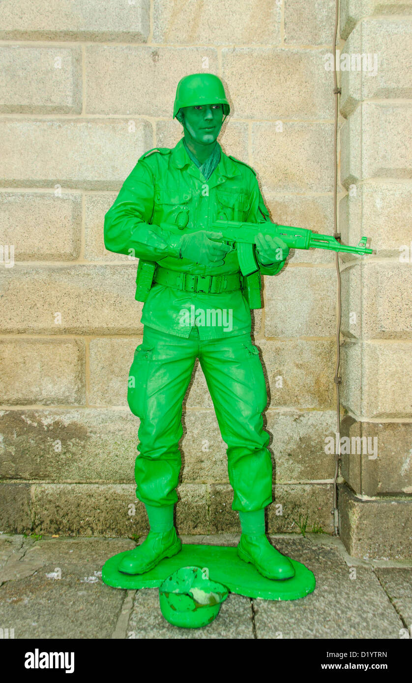A motionless street artist performs in Lemon street Truro UK Stock ...
