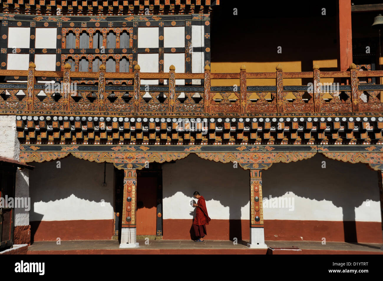 a monk reading walking in a monastery Stock Photo - Alamy