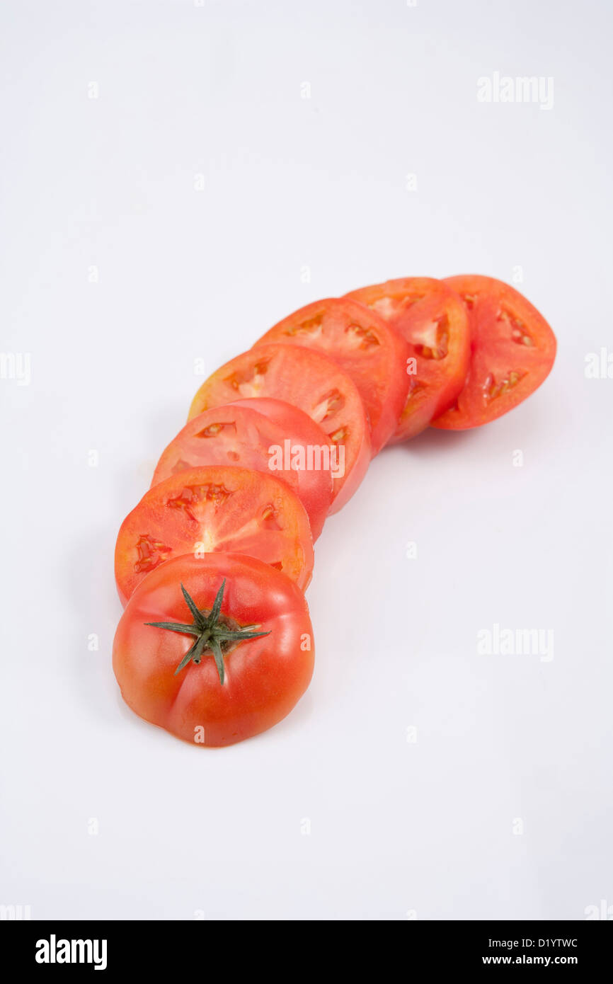 cut tomatoes in a line Stock Photo - Alamy