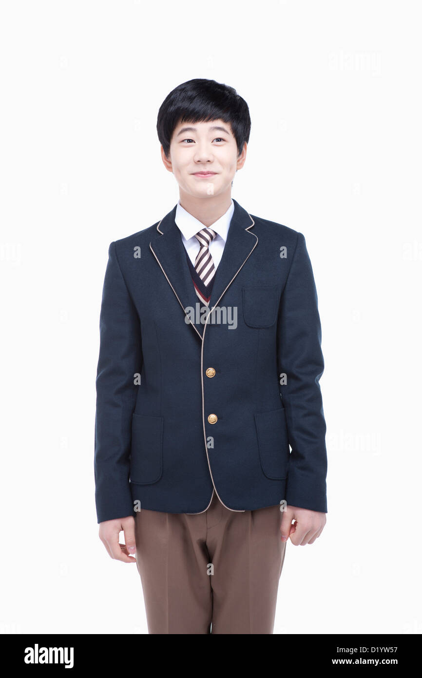 a male student with school uniform standing up straight Stock Photo - Alamy