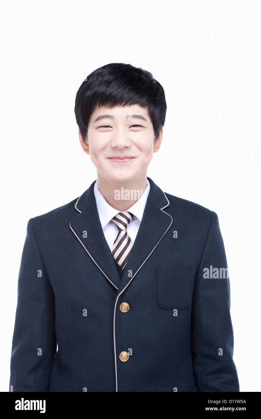 a male student with school uniform smiling Stock Photo - Alamy