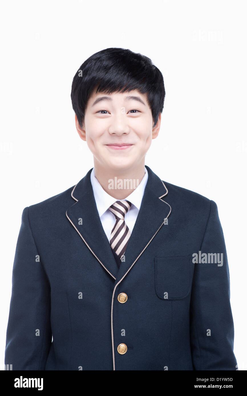 a male student with school uniform smiling Stock Photo - Alamy
