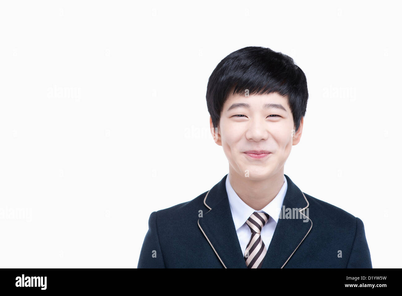 a male student with school uniform smiling Stock Photo - Alamy