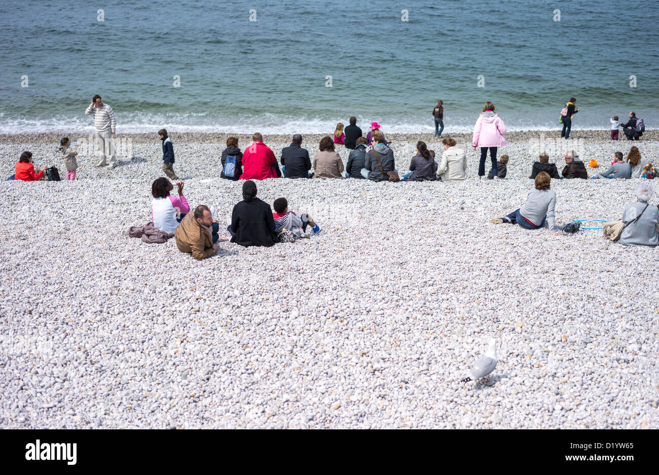 France, Normandy, people in the beach with cliffs of Etretat Stock ...