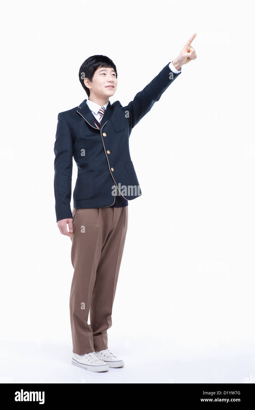 a male student wearing school uniform pointing Stock Photo - Alamy