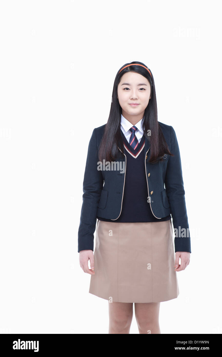 a female student with school uniform standing up straight Stock Photo ...