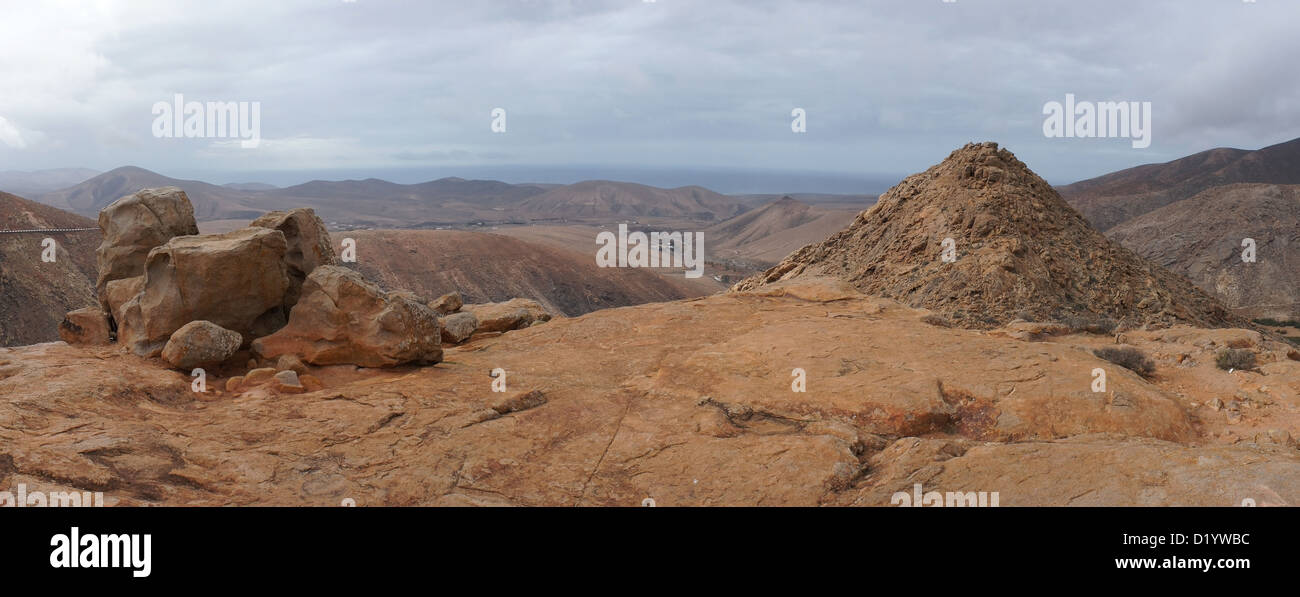 Panorama of volcanic hills, Fuerteventura, Canary Islands. Ocean in ...