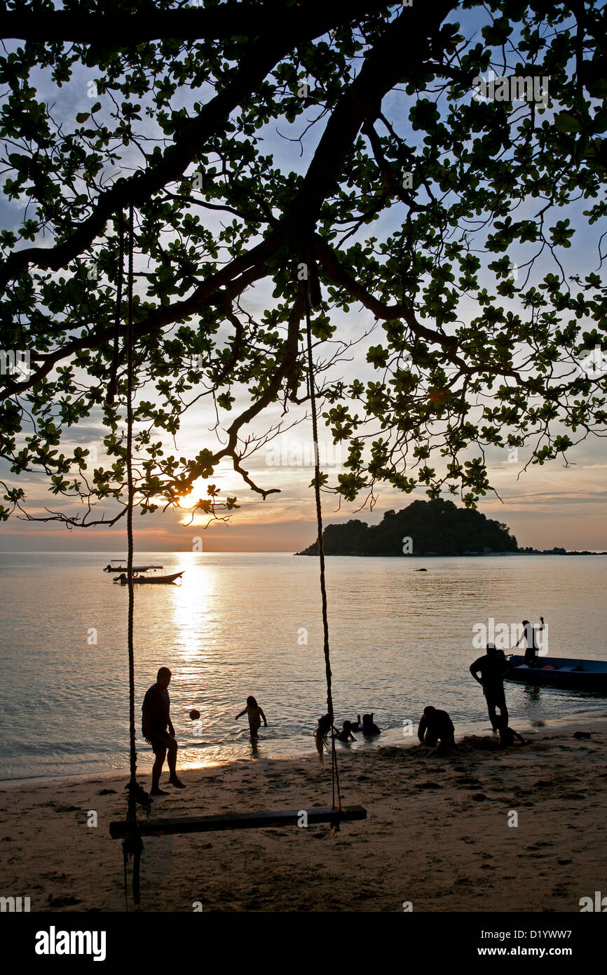 People relaxing on the beach. Teluk Nipah beach. Pulau Pangkor Island ...