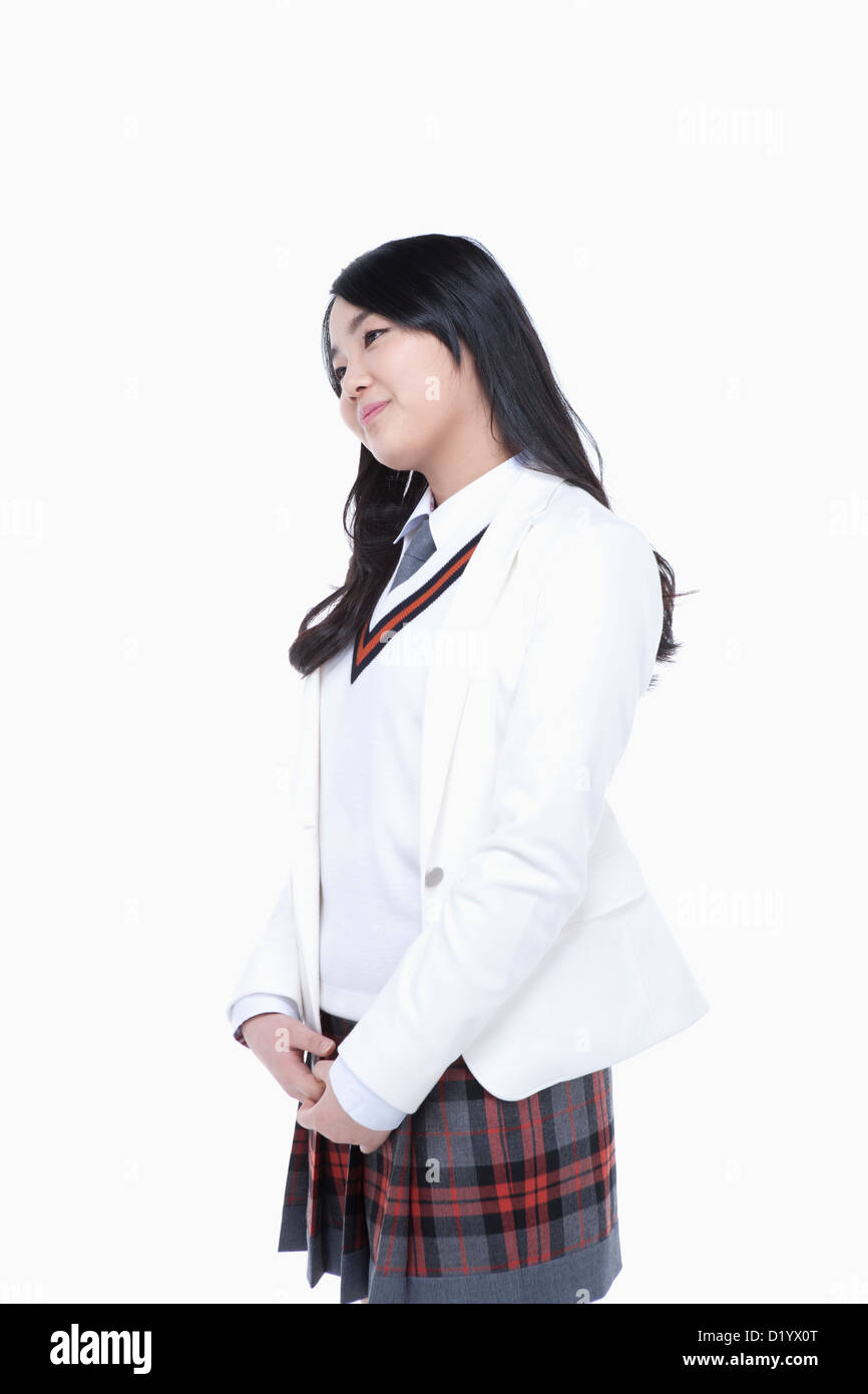 a female student in school uniform wearing a white jacket Stock Photo ...
