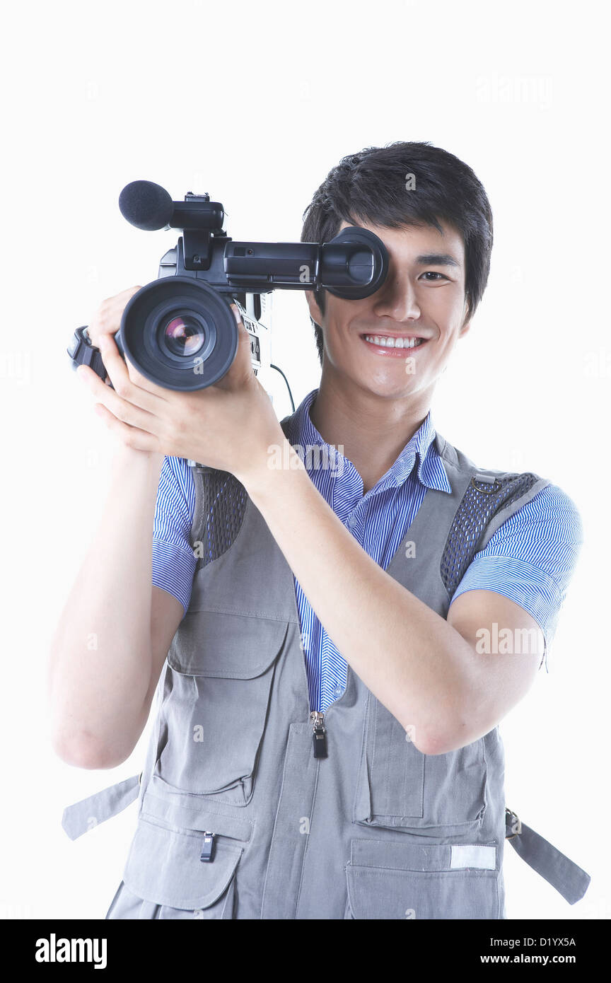 a cameraman in white background Stock Photo - Alamy