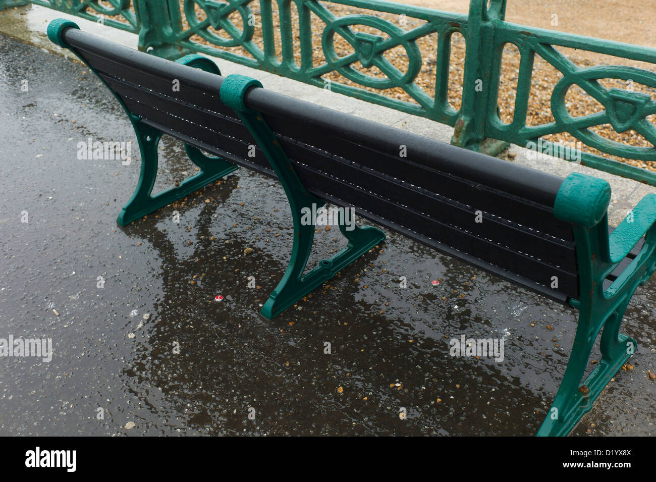 Seaside bench and reflection in rain Stock Photo - Alamy
