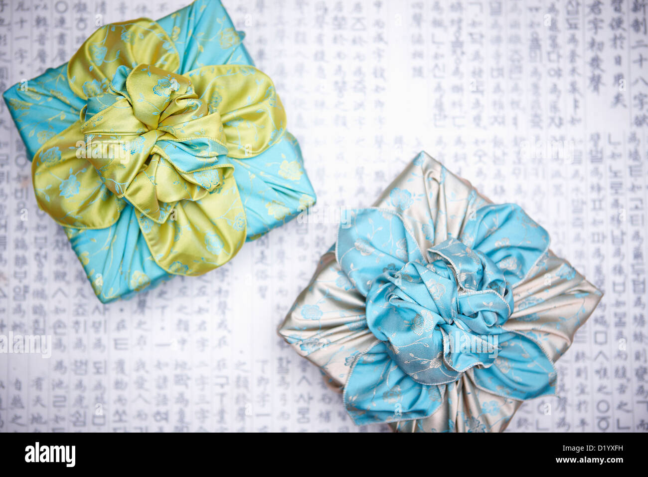 two packages wrapped in a traditional wrap with big ribbons Stock Photo ...