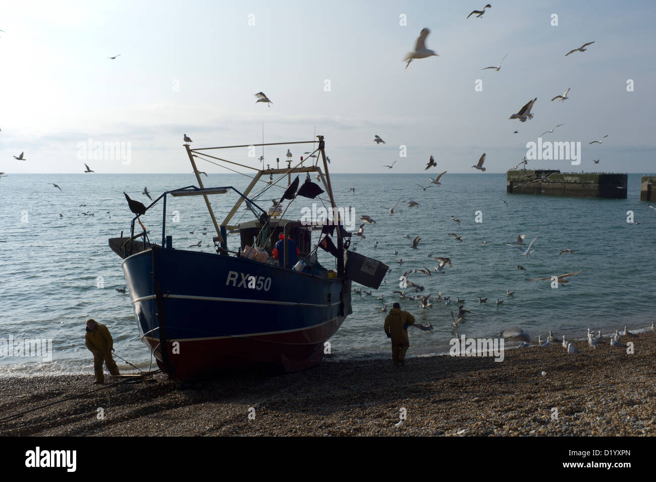 Fishing boat landing, Hastings UK Stock Photo - Alamy