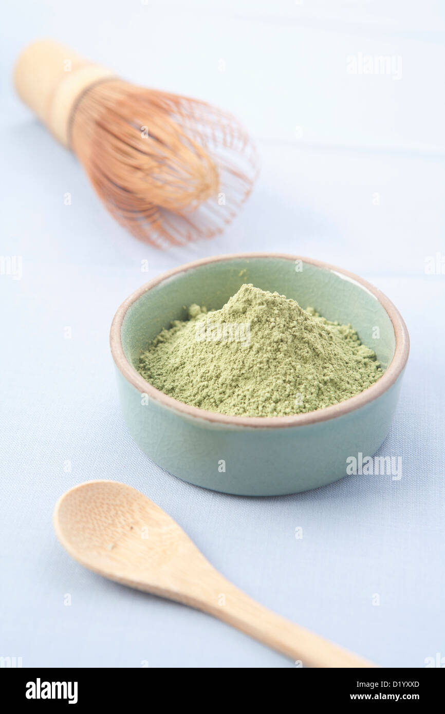 green tea power with a bubble making brush and a spoon Stock Photo - Alamy
