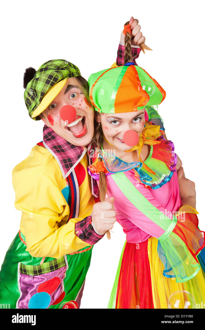 Two clown smiling isolated over a white background Stock Photo - Alamy