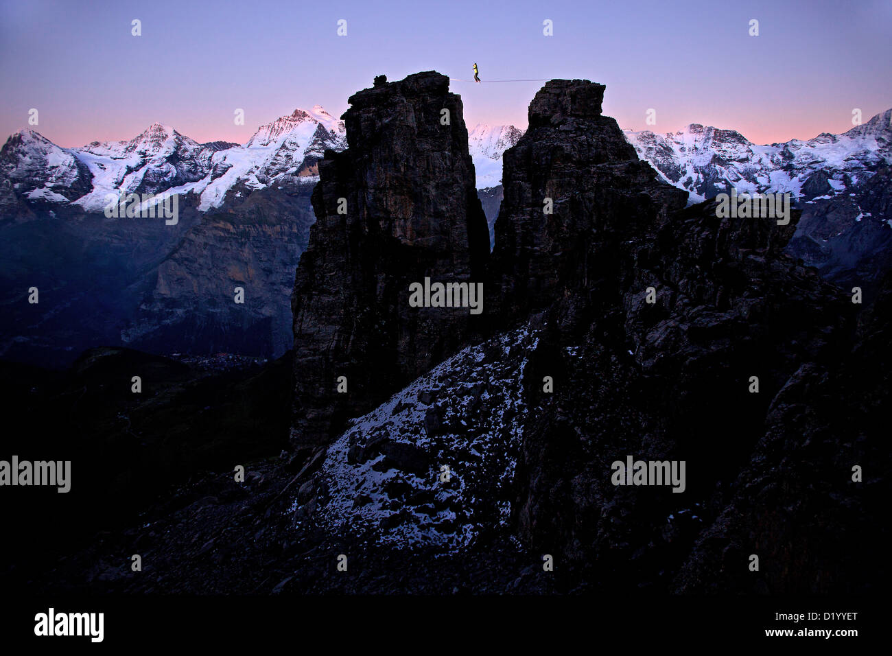 Man walking a highline between two rocks, Schilthorn, Bernese Oberland ...