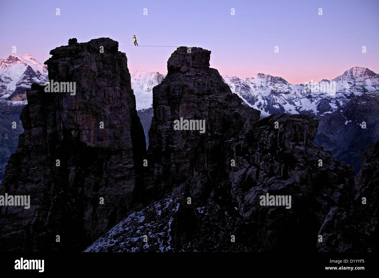 Man walking a highline between two rocks, Schilthorn, Bernese Oberland ...