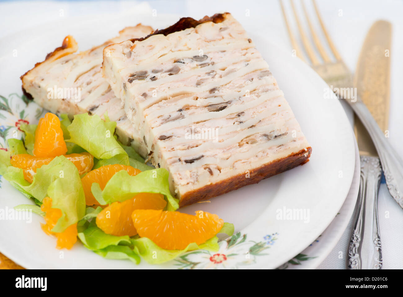 Chicken galantine stuffed with pancakes, meat and mushrooms Stock Photo ...
