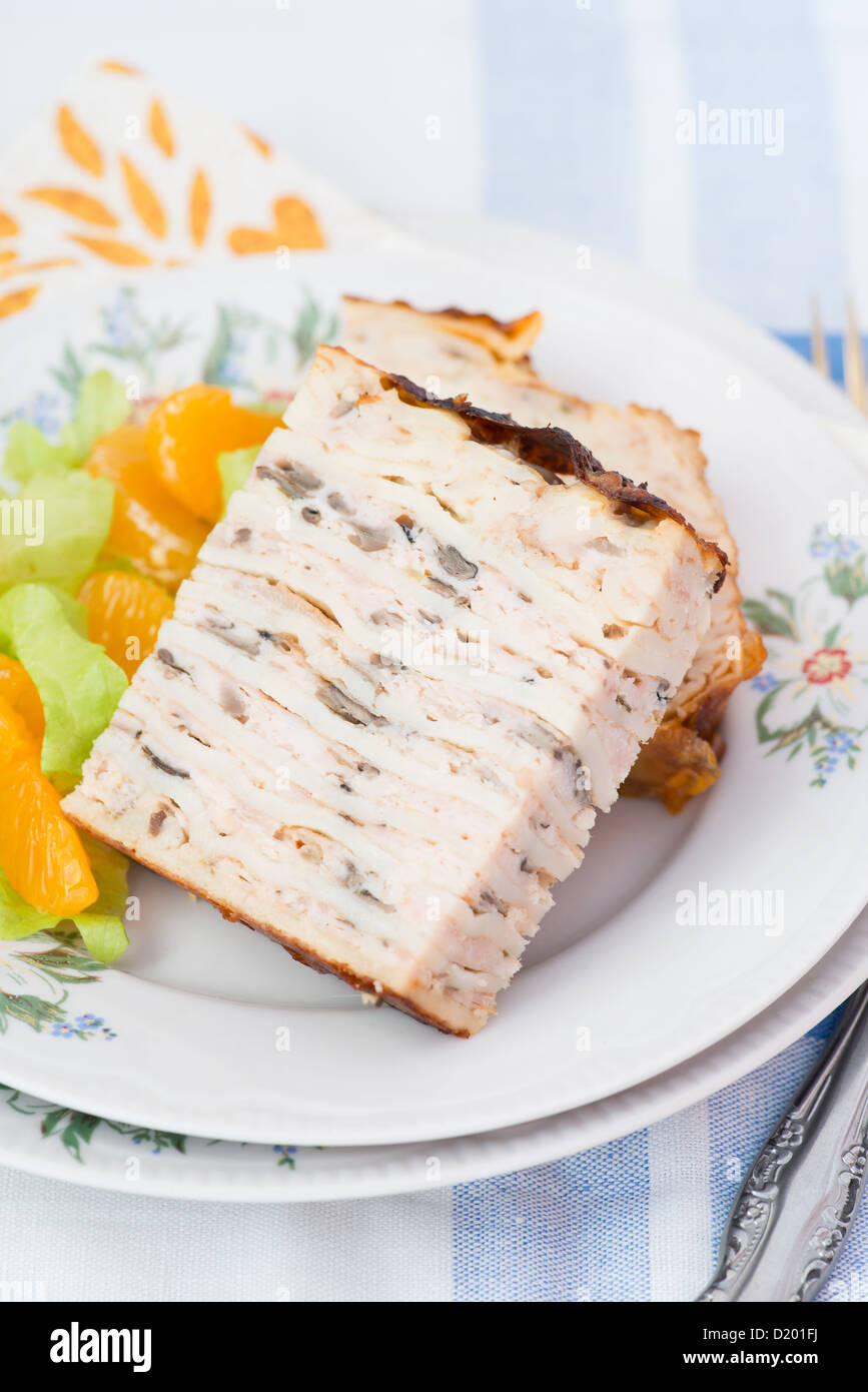 Chicken galantine stuffed with pancakes, meat and mushrooms Stock Photo ...