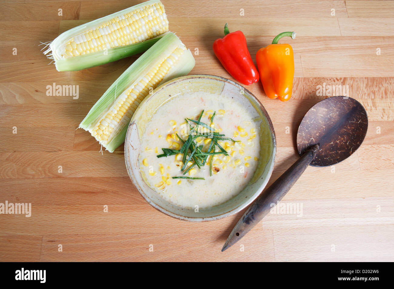 Southwestern Style Corn chowder soup garnished with whole ears of corn ...