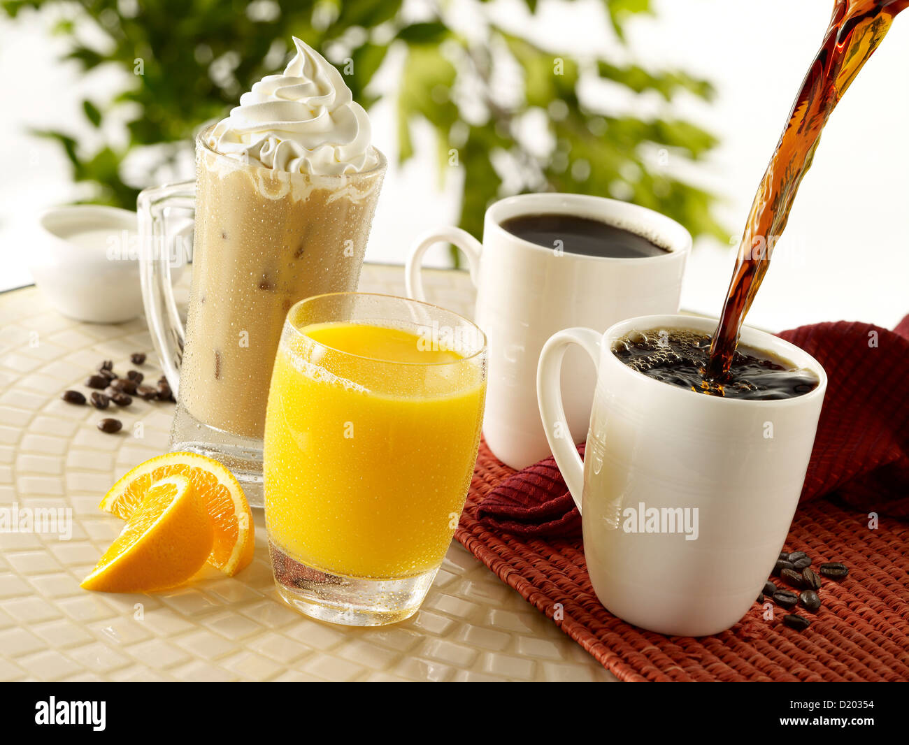 Orange juice with coffee, frappuccino and a coffee pour Stock Photo - Alamy