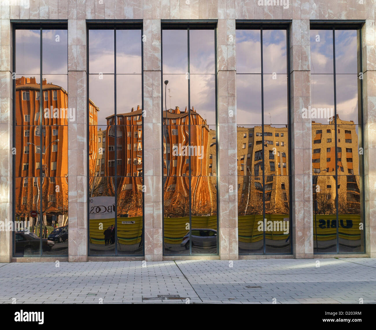 Reflections in tall glass windows of a modern building - Leon, Spain ...