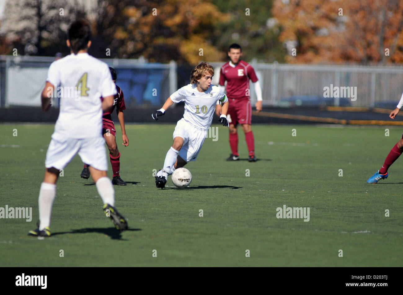 Soccer forward turns toward his opponent's goal deep in the attacking ...