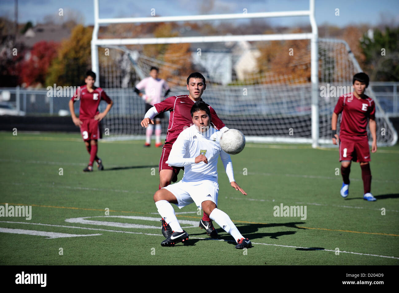 Soccer attacking player gains position over a defender to control the ...