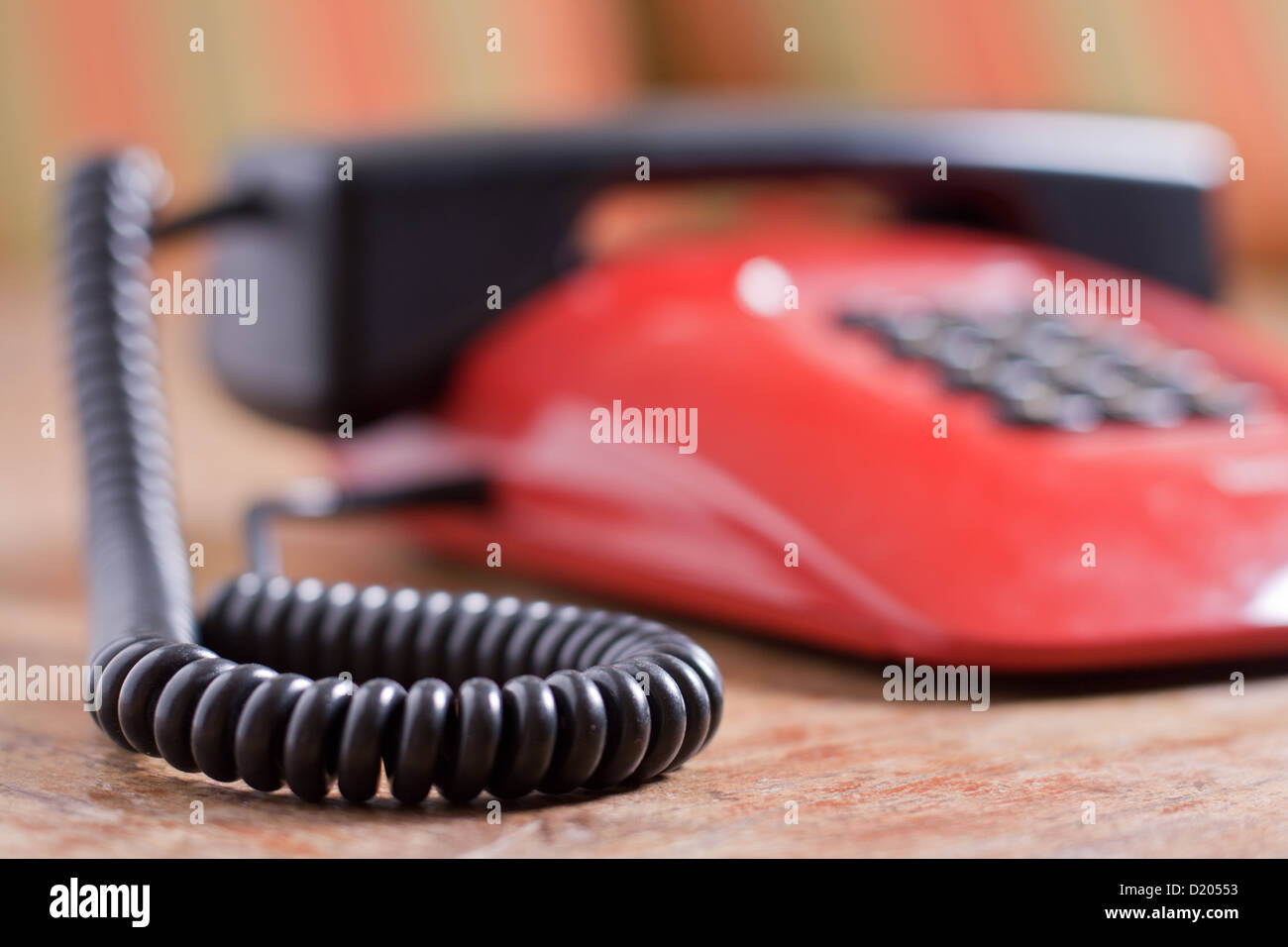 Old fashioned telephone with receiver on the hook Stock Photo - Alamy